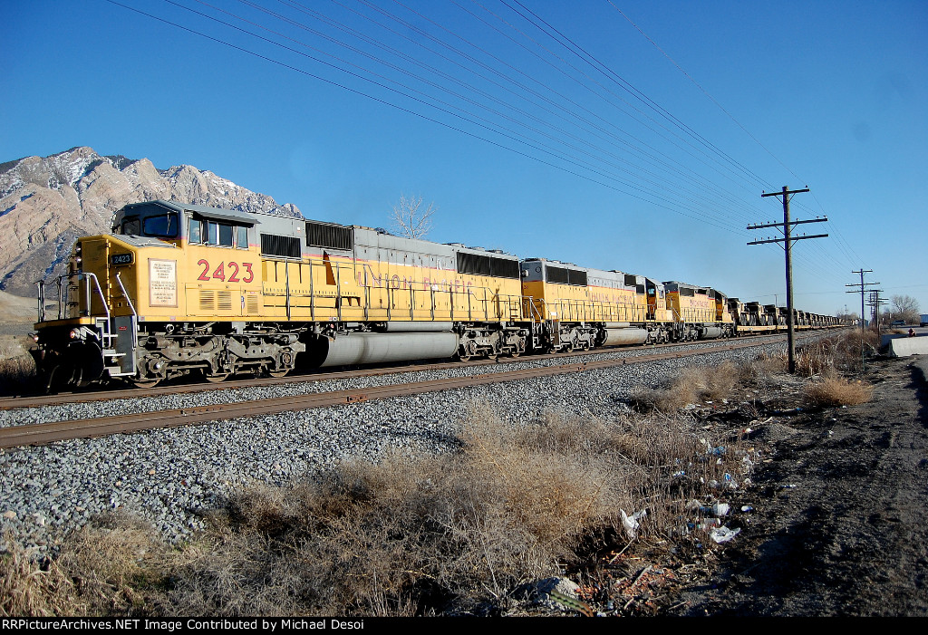 UP "Triclops" SD-60M #2423 leads an SD-60, SD-40-2 combo on a northbound train, bound for the ...
